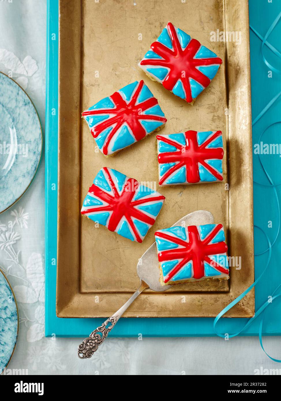 Union Jack cakes on a golden cake tray (seen from above Stock Photo - Alamy