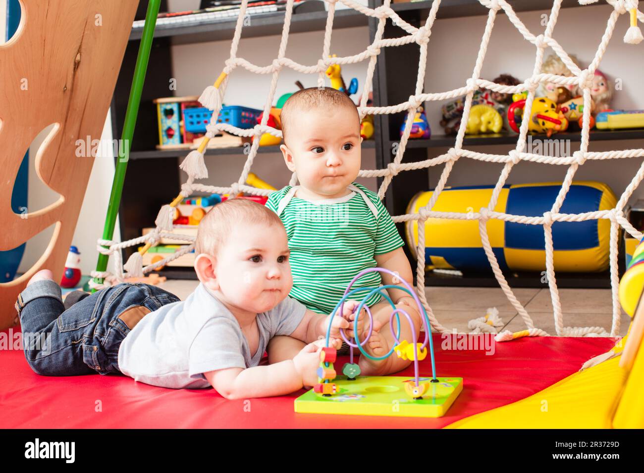 Two babies having fun Stock Photo - Alamy