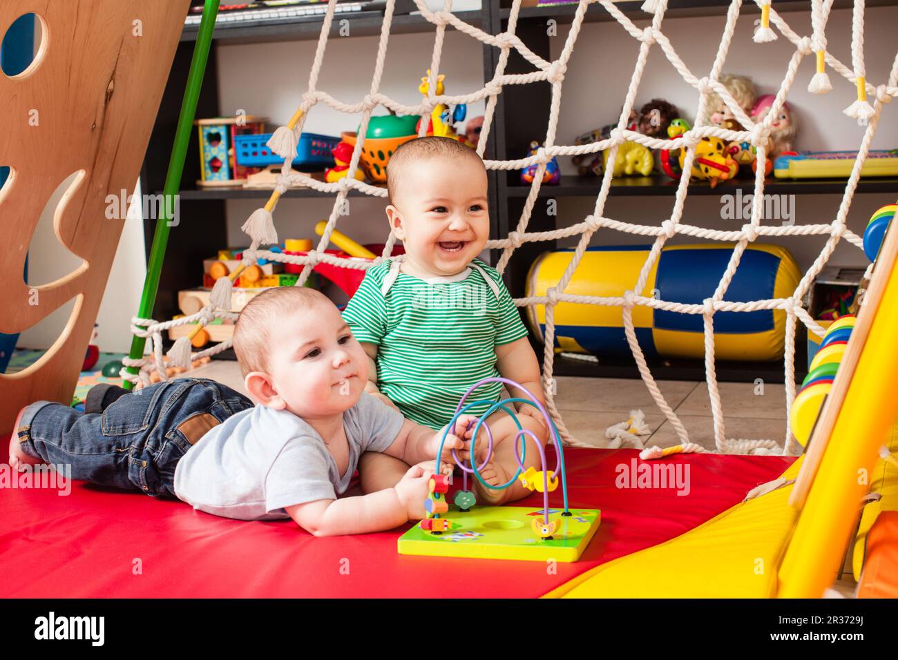 Two babies having fun Stock Photo - Alamy
