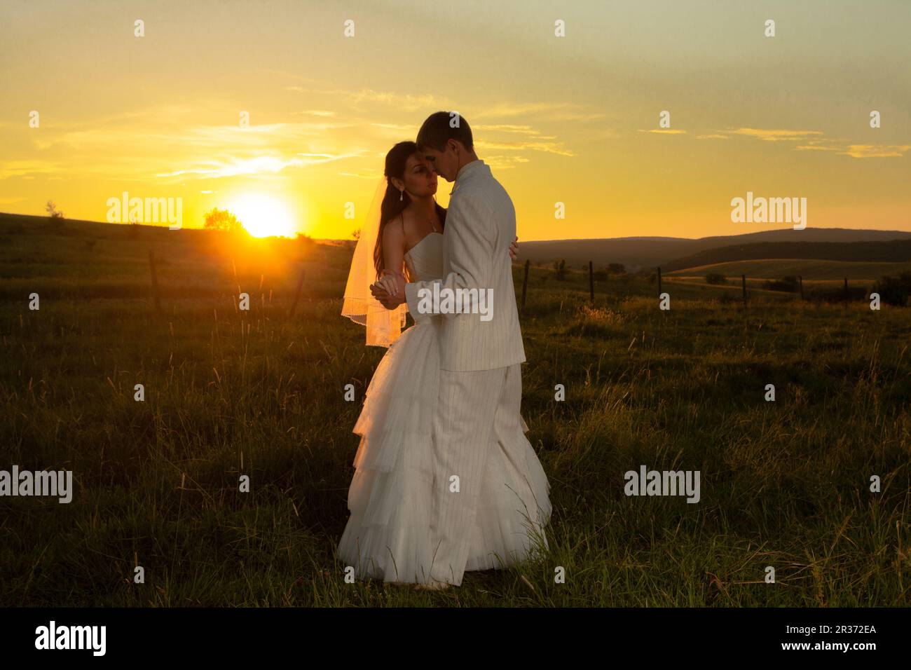 Wedding couple on sunset Stock Photo - Alamy