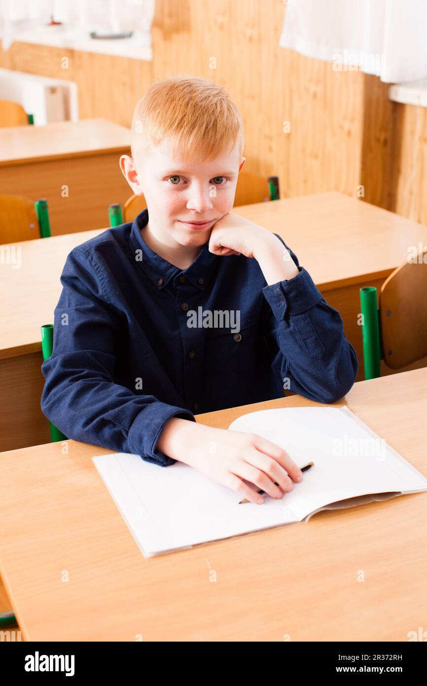 Boy white in the copybook Stock Photo - Alamy