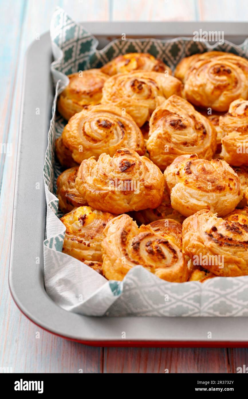 Puff pastry swirls with sheep's cheese Stock Photo - Alamy