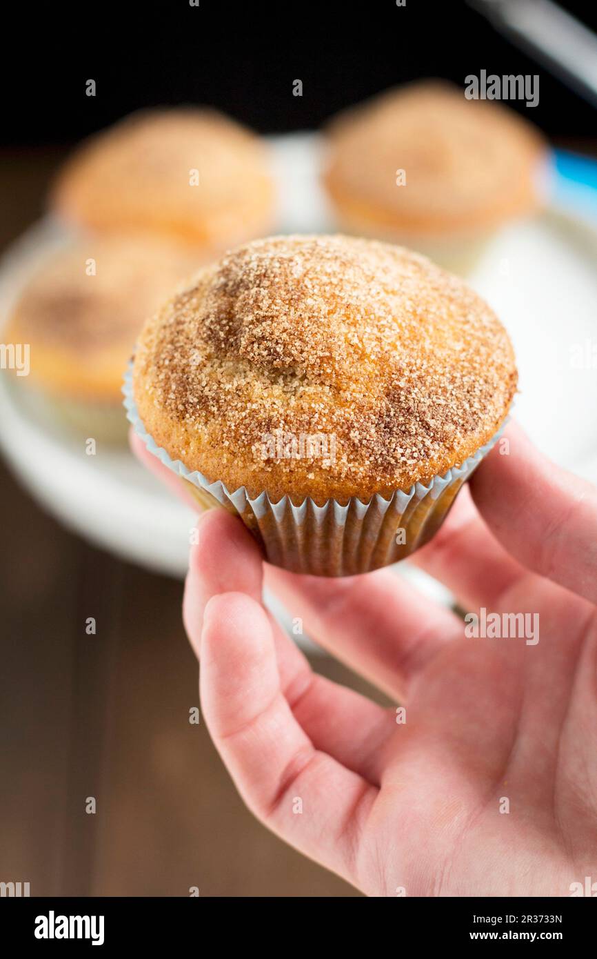 A hand holding a Nutella doughnut muffin Stock Photo - Alamy