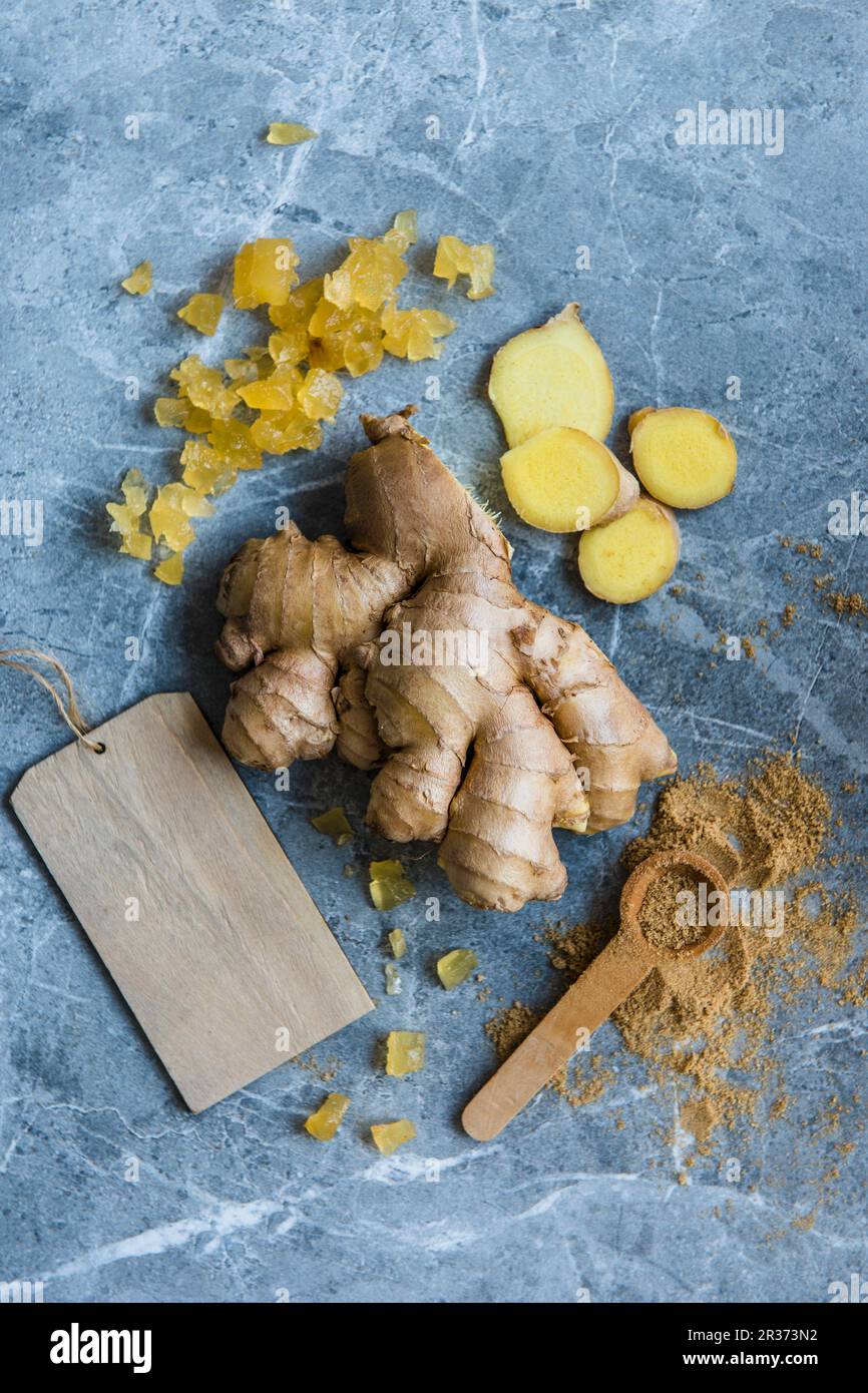 Different types of ginger, fresh, grounded and candied, view from above ...