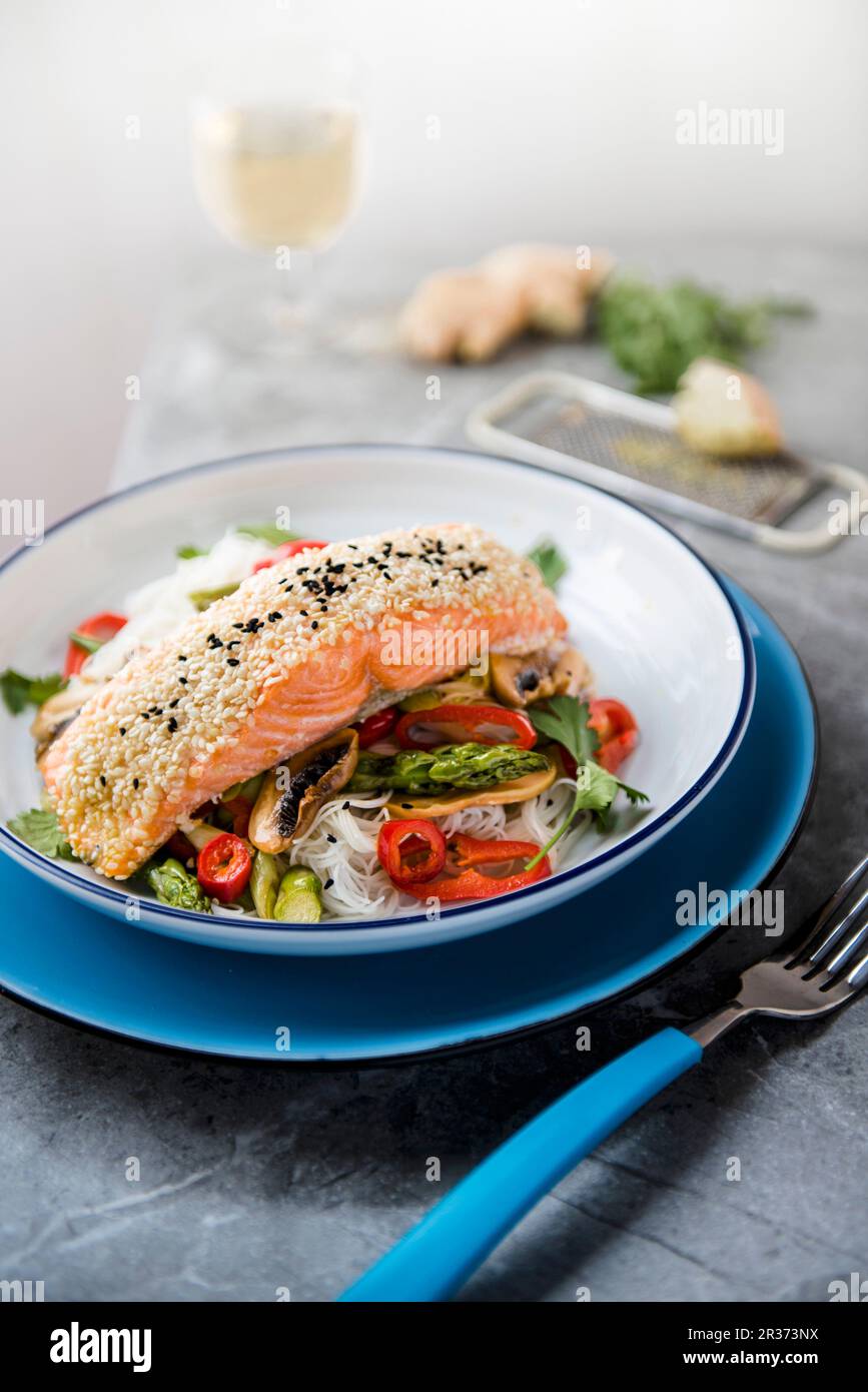 Seasame seed crusted salmon with ginger stir fry Stock Photo - Alamy