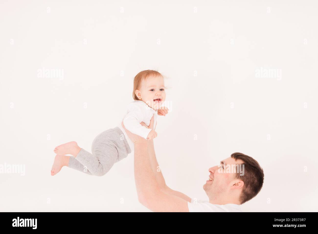 Dad and baby having fun Stock Photo - Alamy