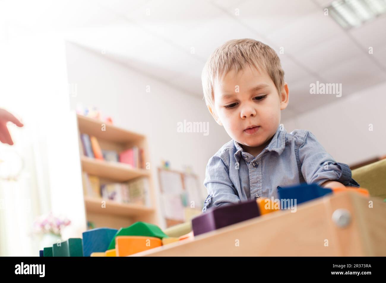 Boy playing with cubes Stock Photo - Alamy