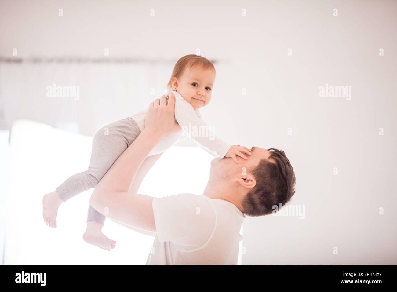 Dad and baby having fun Stock Photo - Alamy