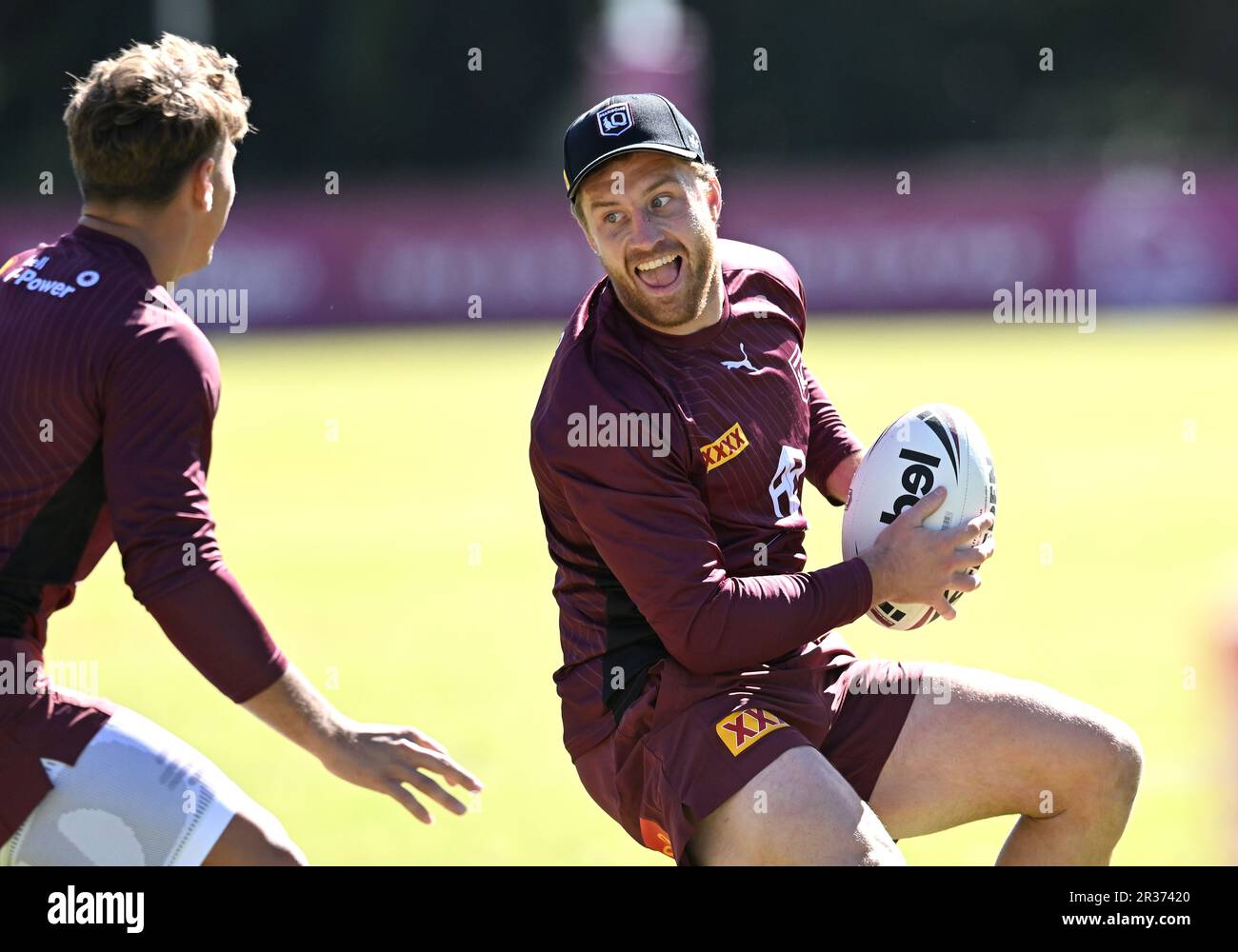 Cameron Munster (right) takes on Reece Walsh (left) during a Queensland ...