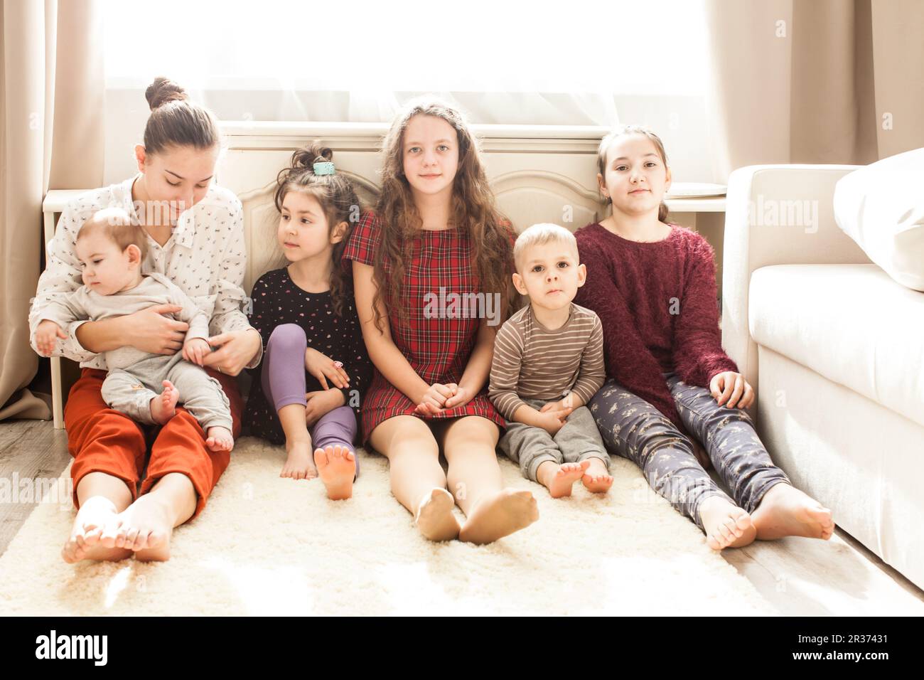 Big family of siblings Stock Photo - Alamy
