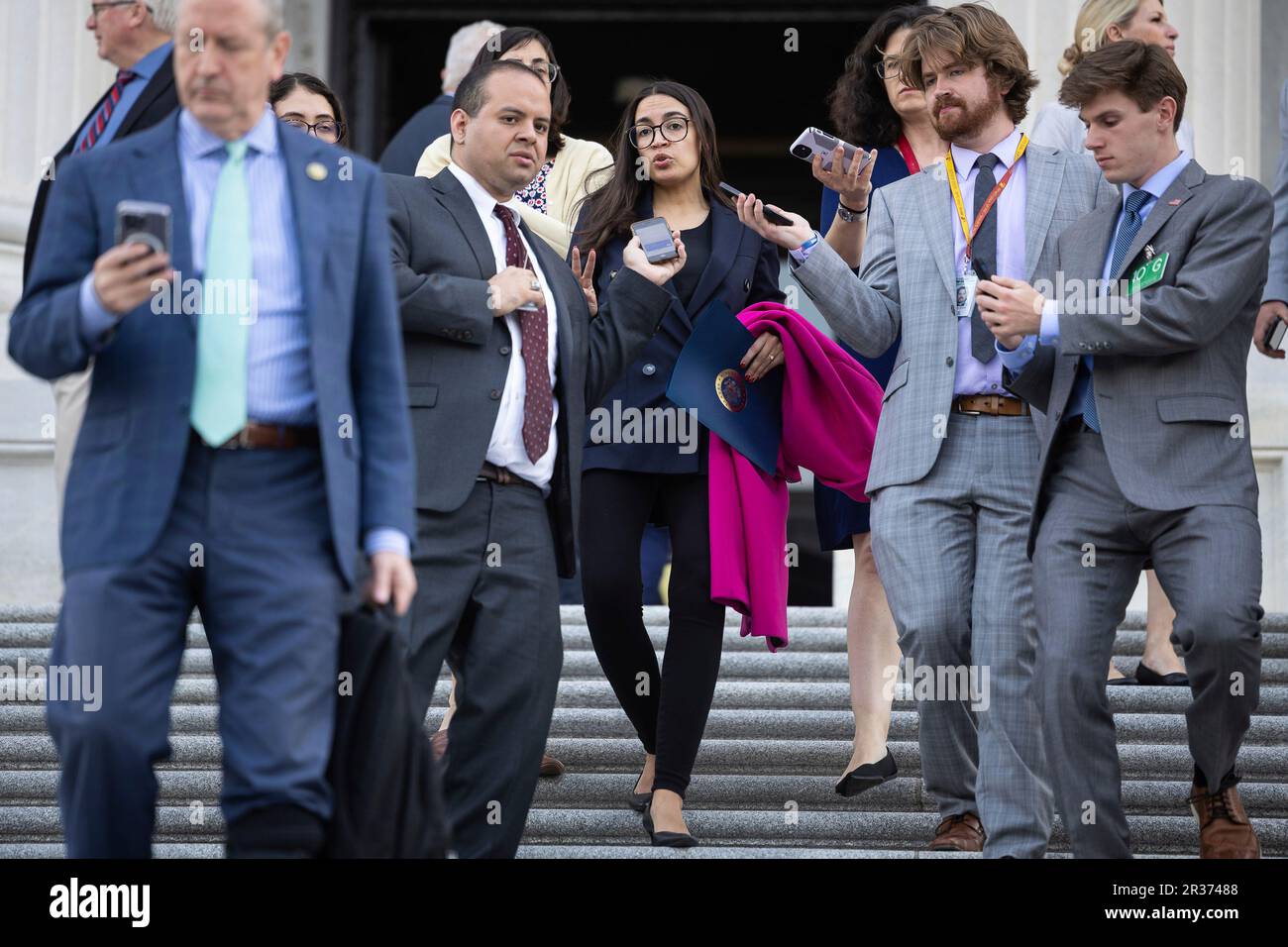 Rep. Alexandria Ocasio-Cortez (D-N.Y.) speaks with reporters as she ...