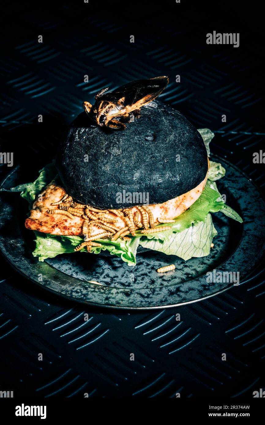 Halloween Chicken burger with Mealworms and topped with a giant ...