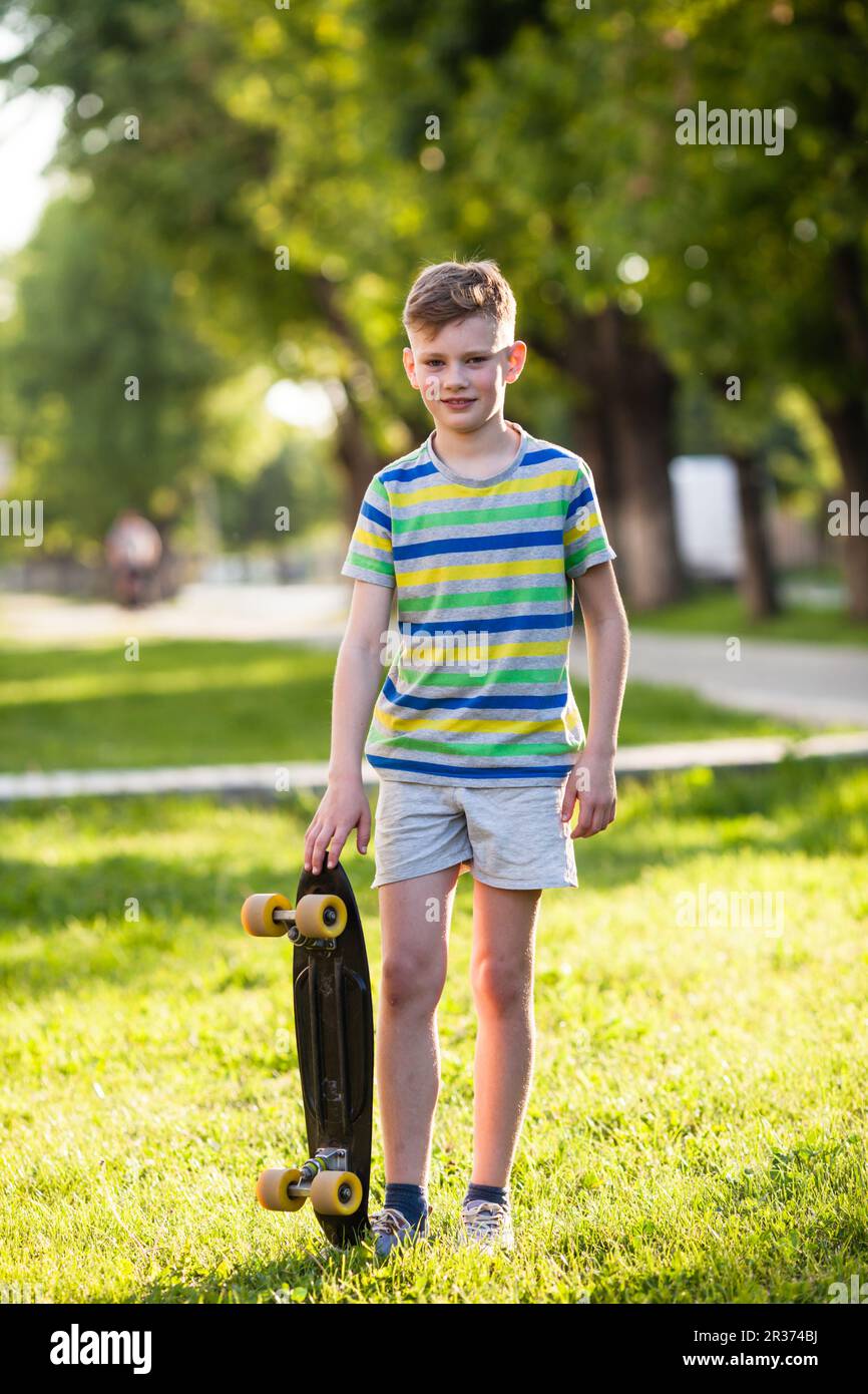Boy riding a skateboard Stock Photo - Alamy