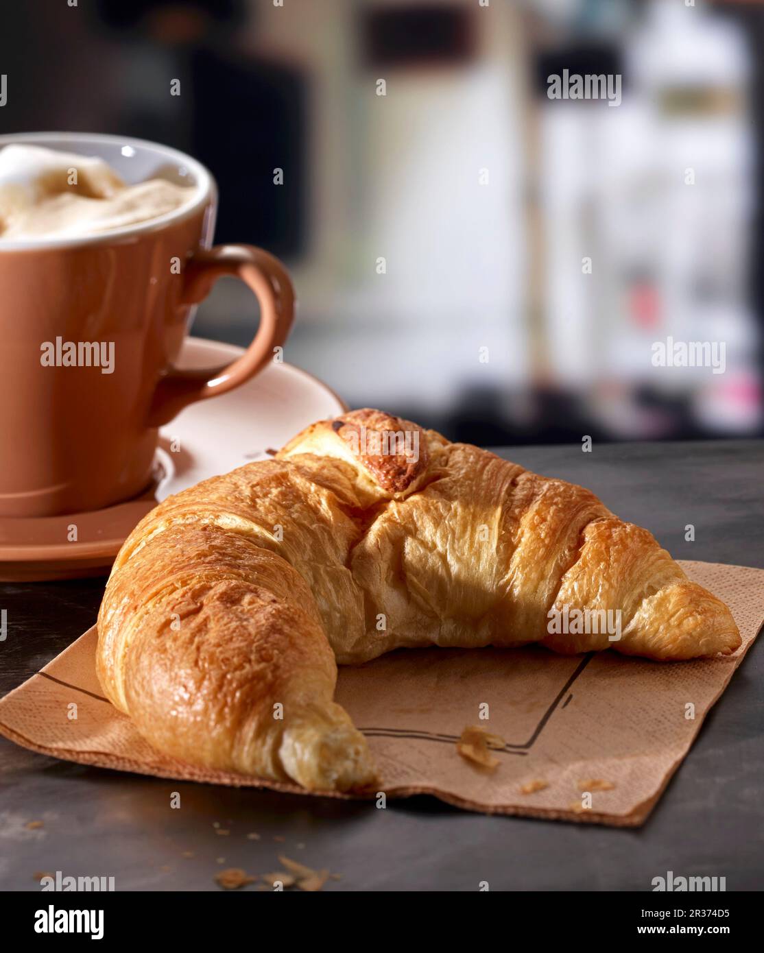 A croissant with a latte in a cafe Stock Photo - Alamy