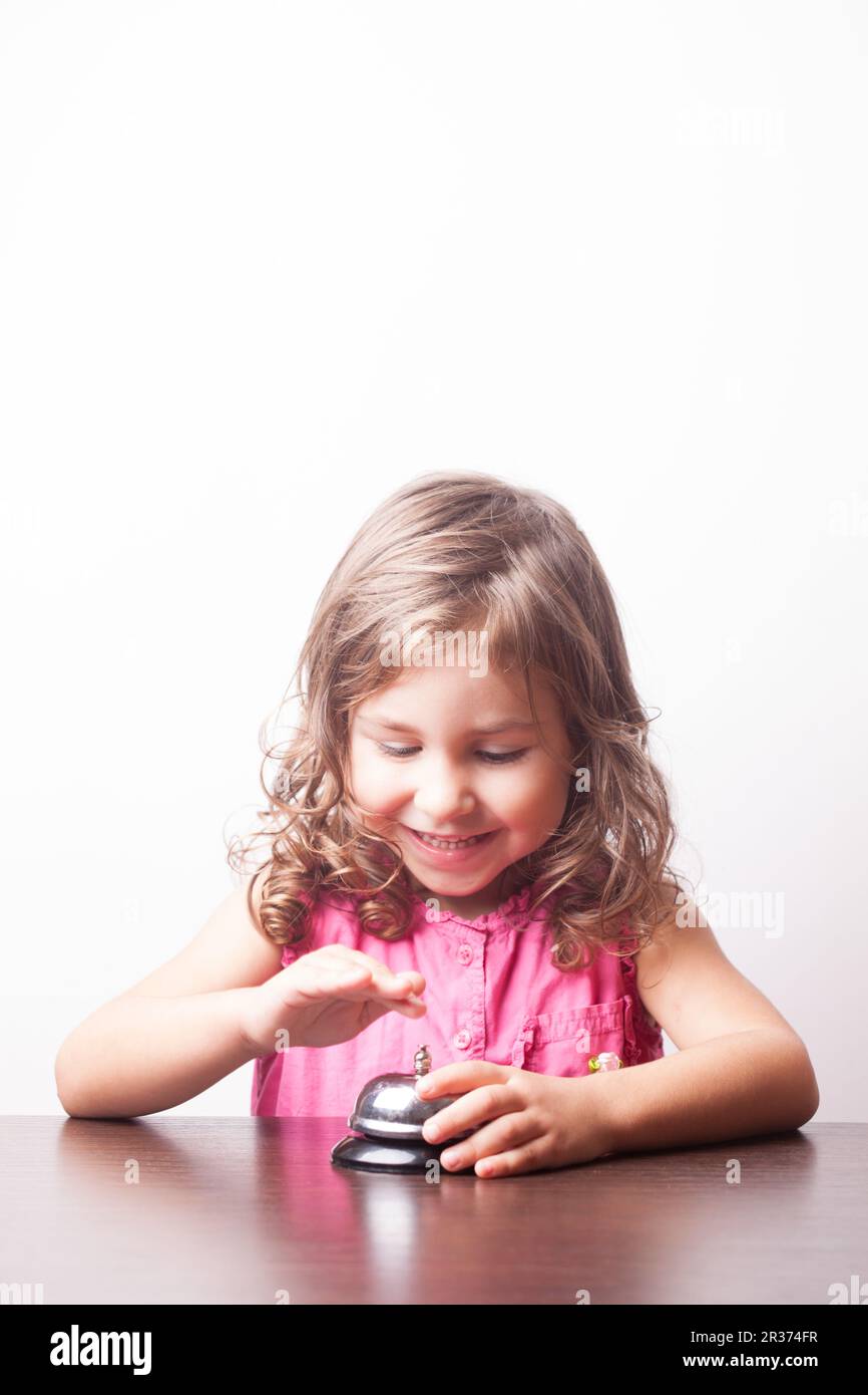 Girl push on the bell Stock Photo - Alamy