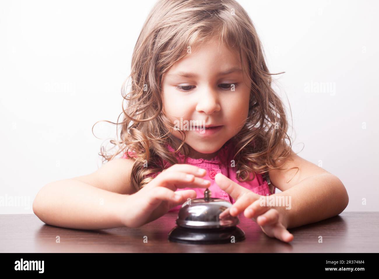 Girl push on the bell Stock Photo - Alamy
