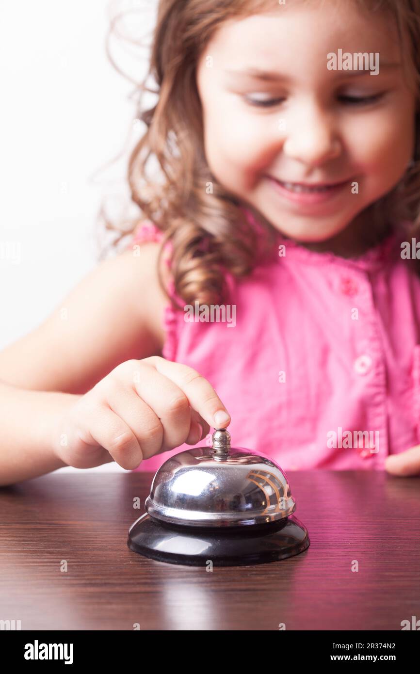 Girl push on the bell Stock Photo - Alamy