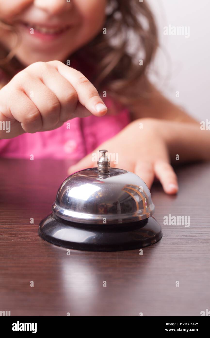 Girl push on the bell Stock Photo - Alamy