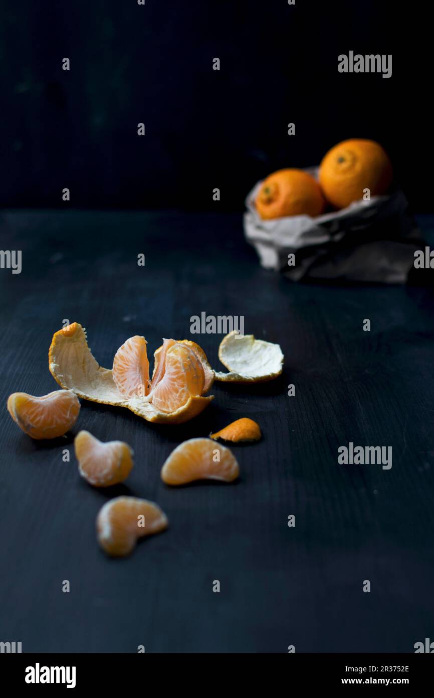 Mandarins, whole and peeled Stock Photo - Alamy