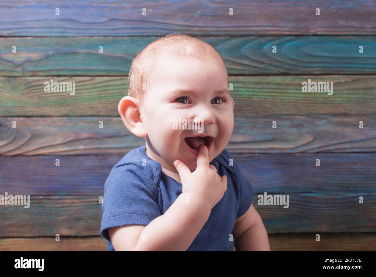 Child with finger in mouth Stock Photo - Alamy