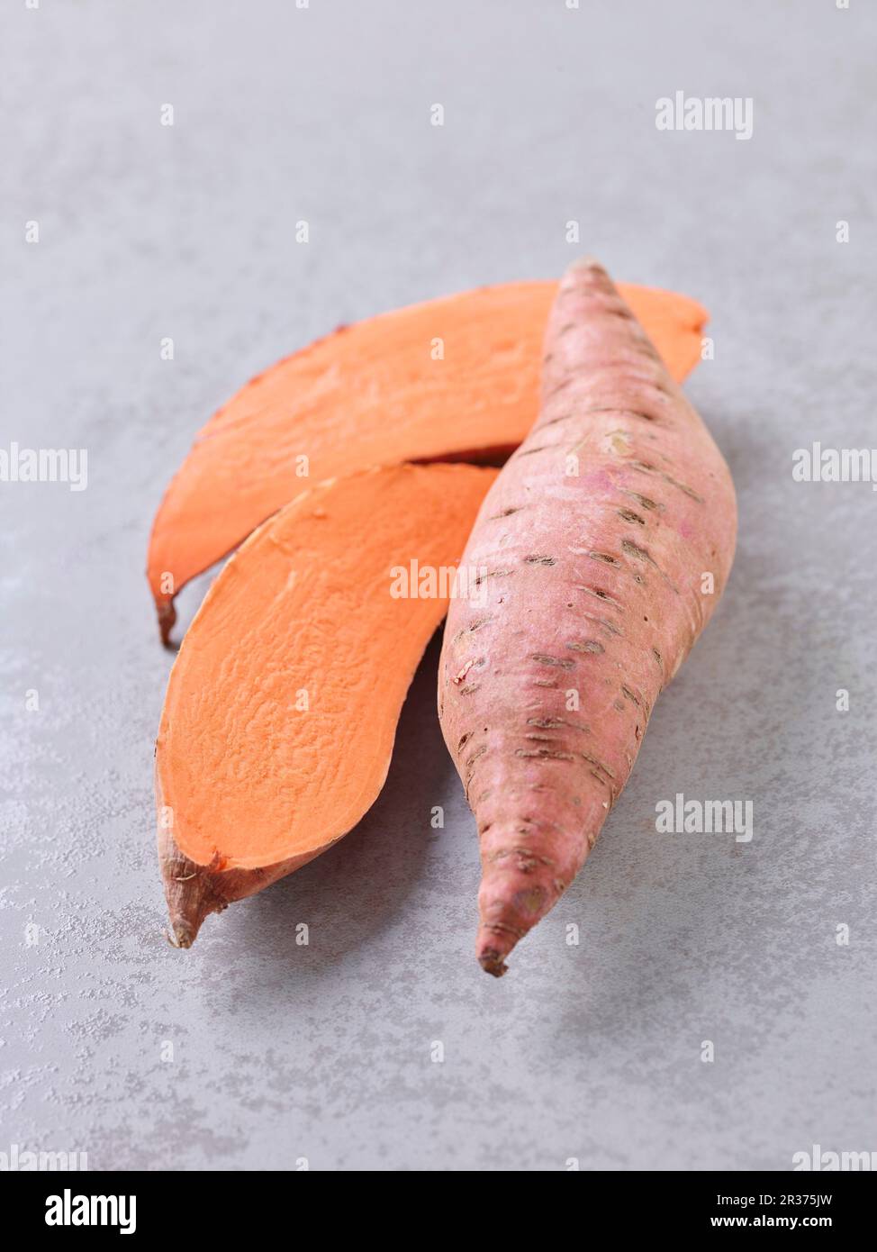 Sweet potatoes, whole and halved Stock Photo - Alamy