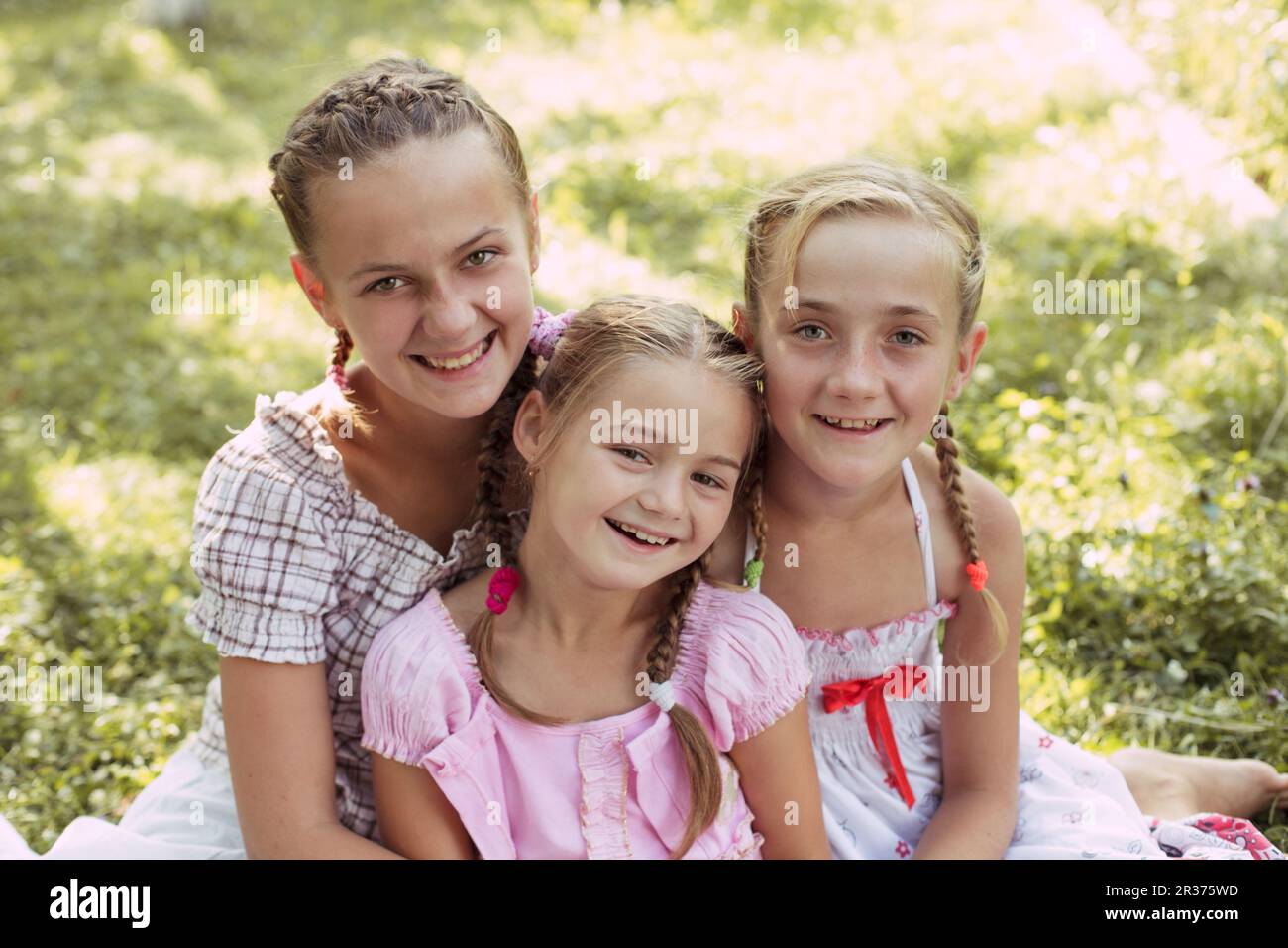 Three girls outdoors Stock Photo - Alamy