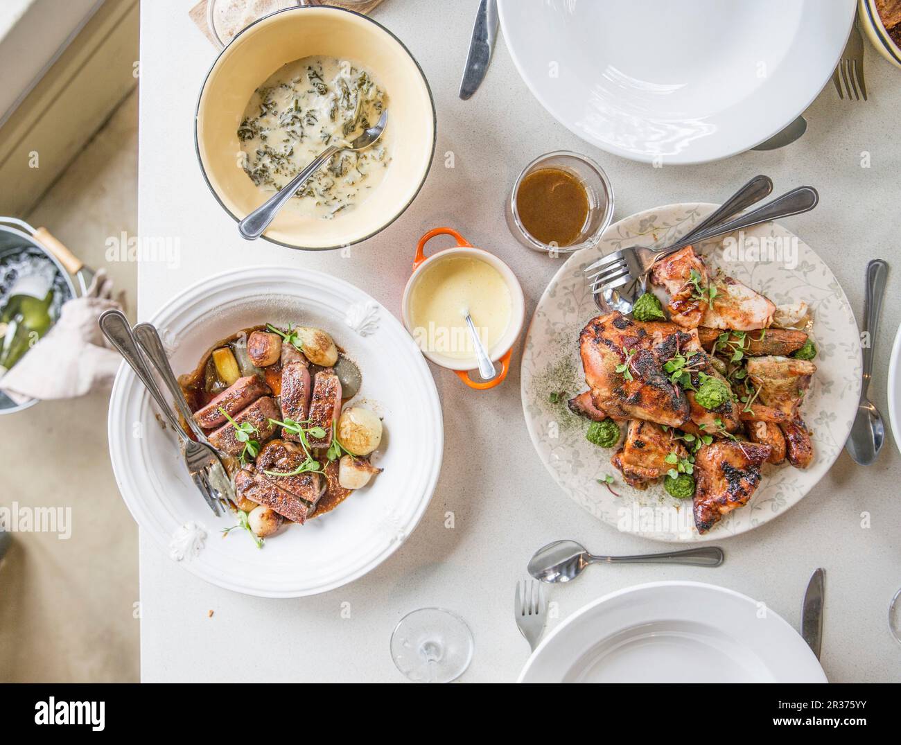 A table laid with various dishes for lunch Stock Photo - Alamy