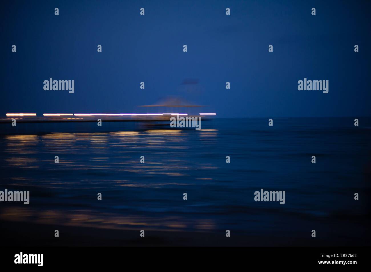 Romantic pier at night Stock Photo - Alamy