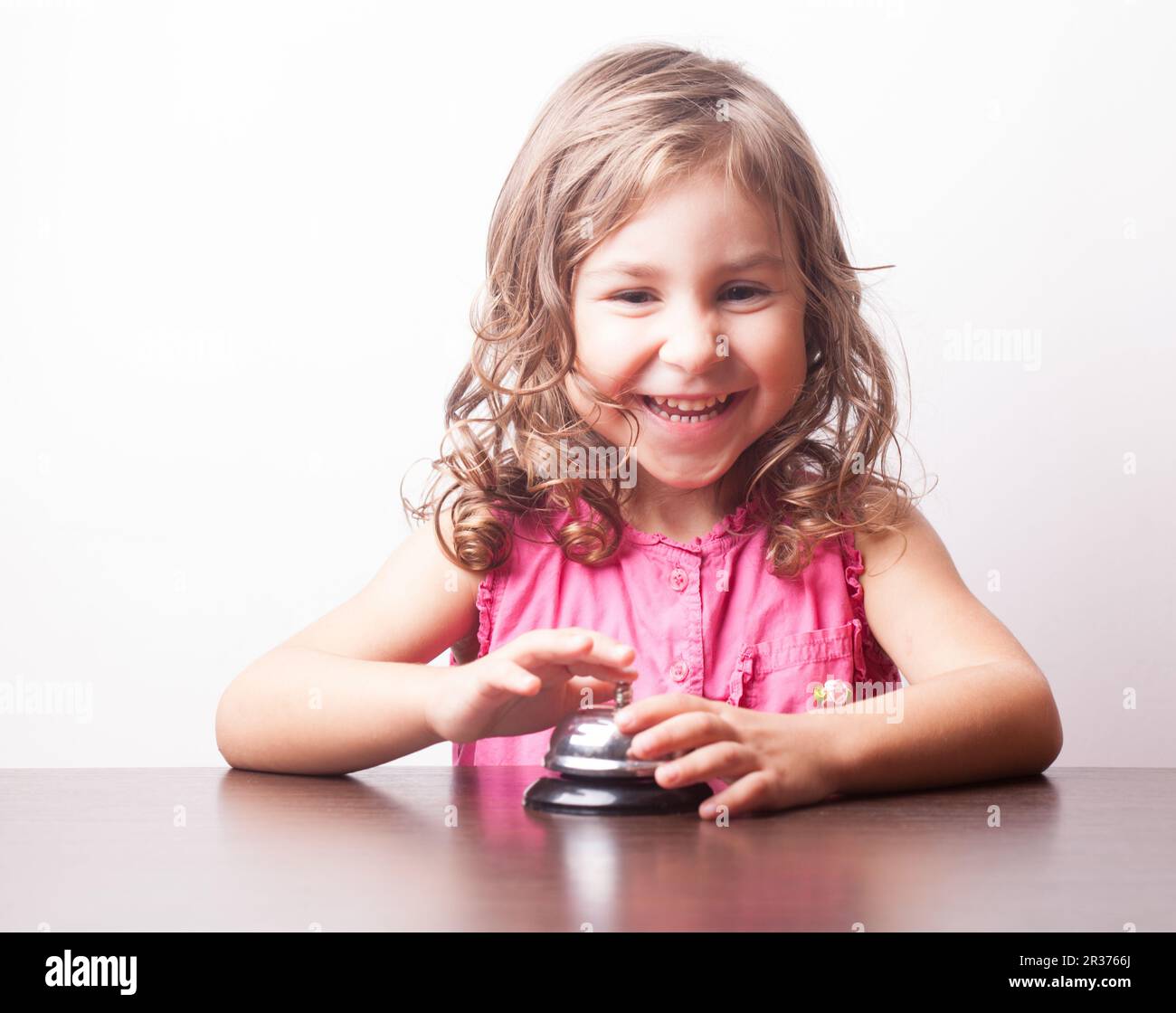 Girl push on the bell Stock Photo - Alamy