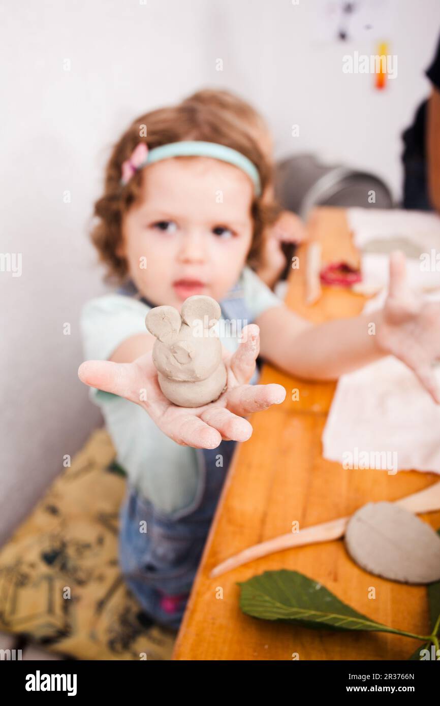 Child making plasticine rabbit hi-res stock photography and images - Alamy