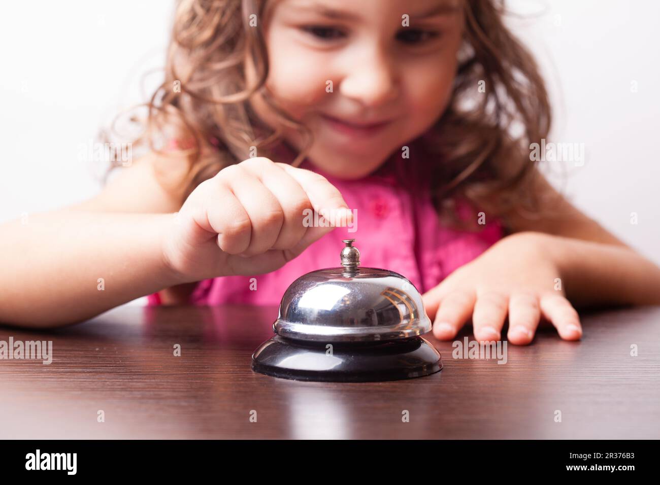 Girl push on the bell Stock Photo - Alamy