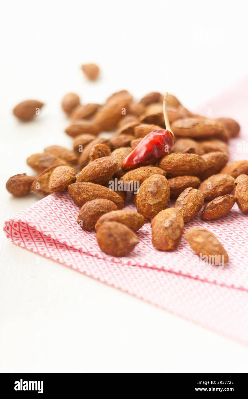 Almonds with a chilli pepper Stock Photo - Alamy