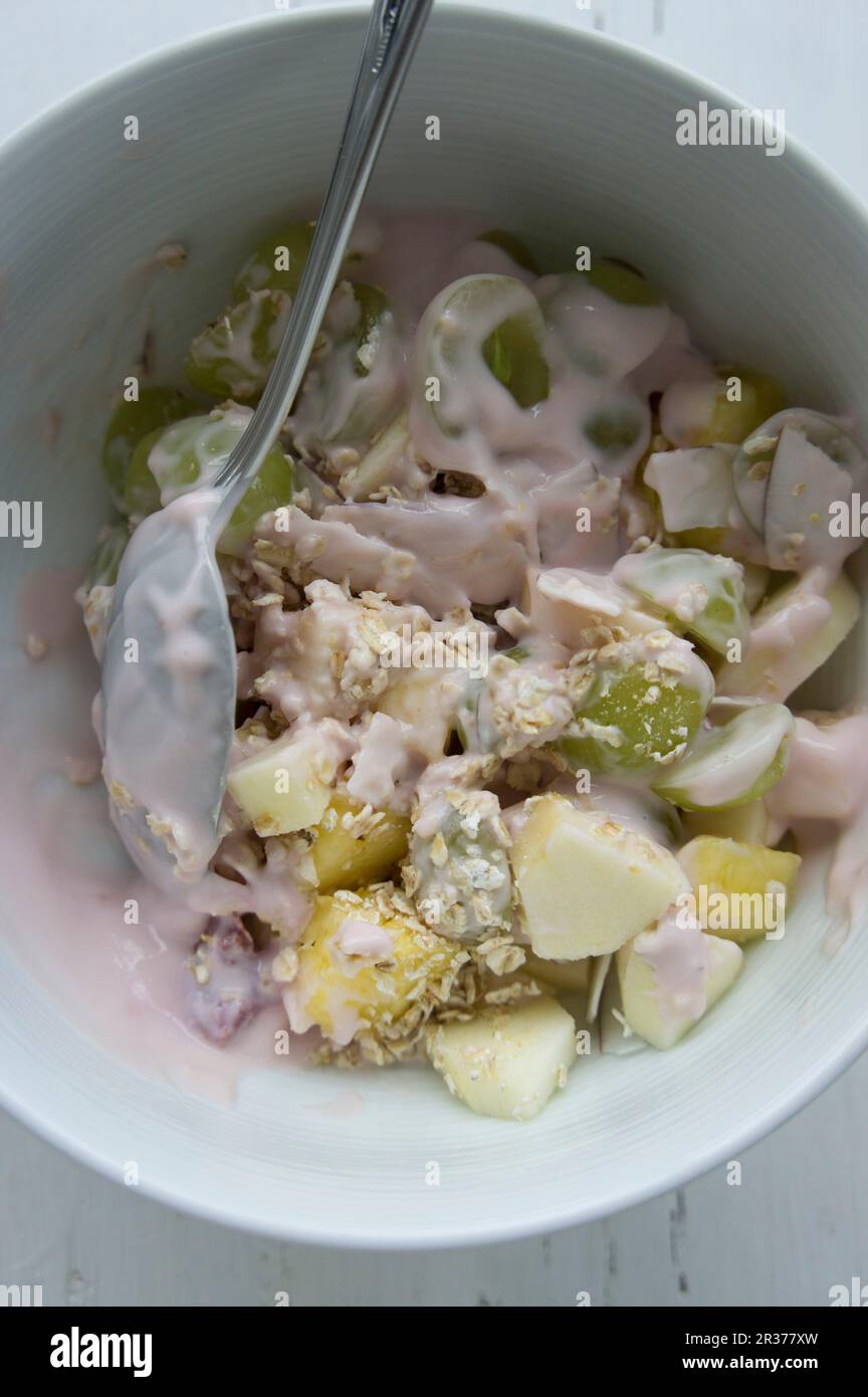 Muesli with oatmeal, grapes, mango, apples, dessicated coconut and ...