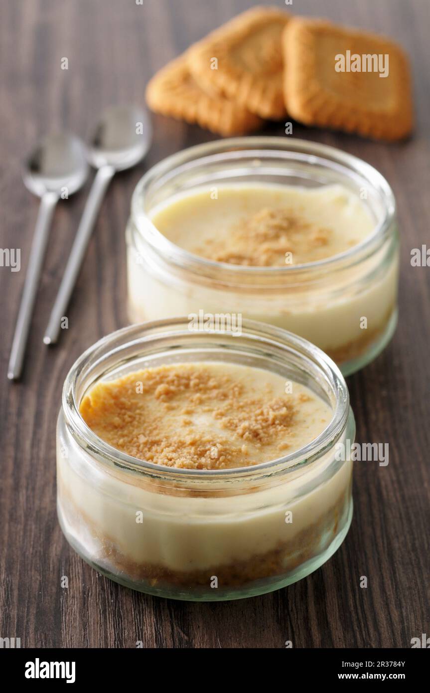 Small cheesecakes with speculoos biscuit bases Stock Photo - Alamy