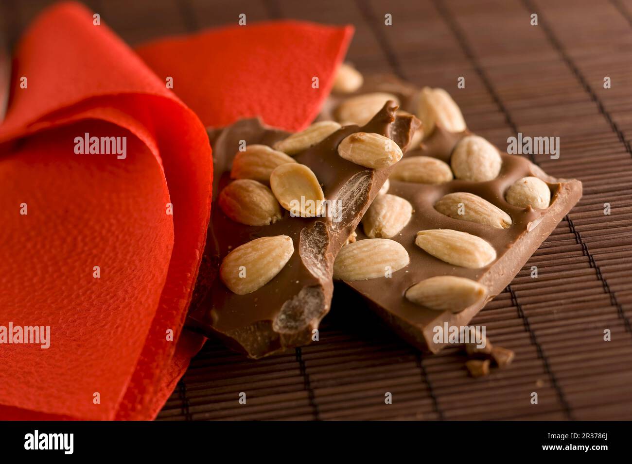 A broken bar of almond chocolate Stock Photo - Alamy