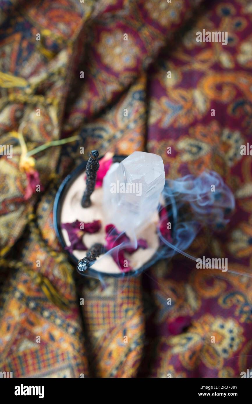 Homemade incense sticks made of smoked coal, resins and dried herbs and ...