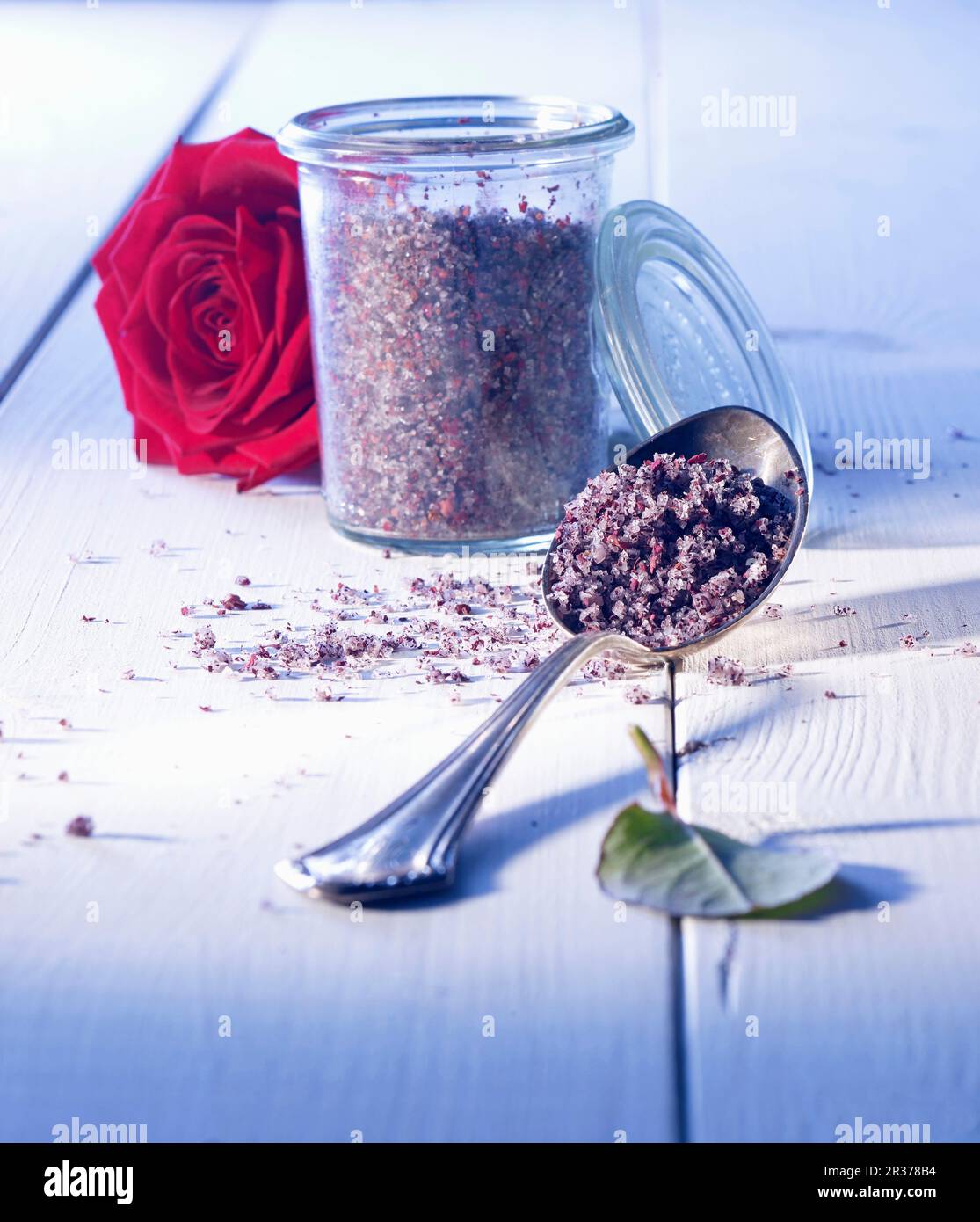 Rose salt in a glass and on a spoon with a rose Stock Photo - Alamy
