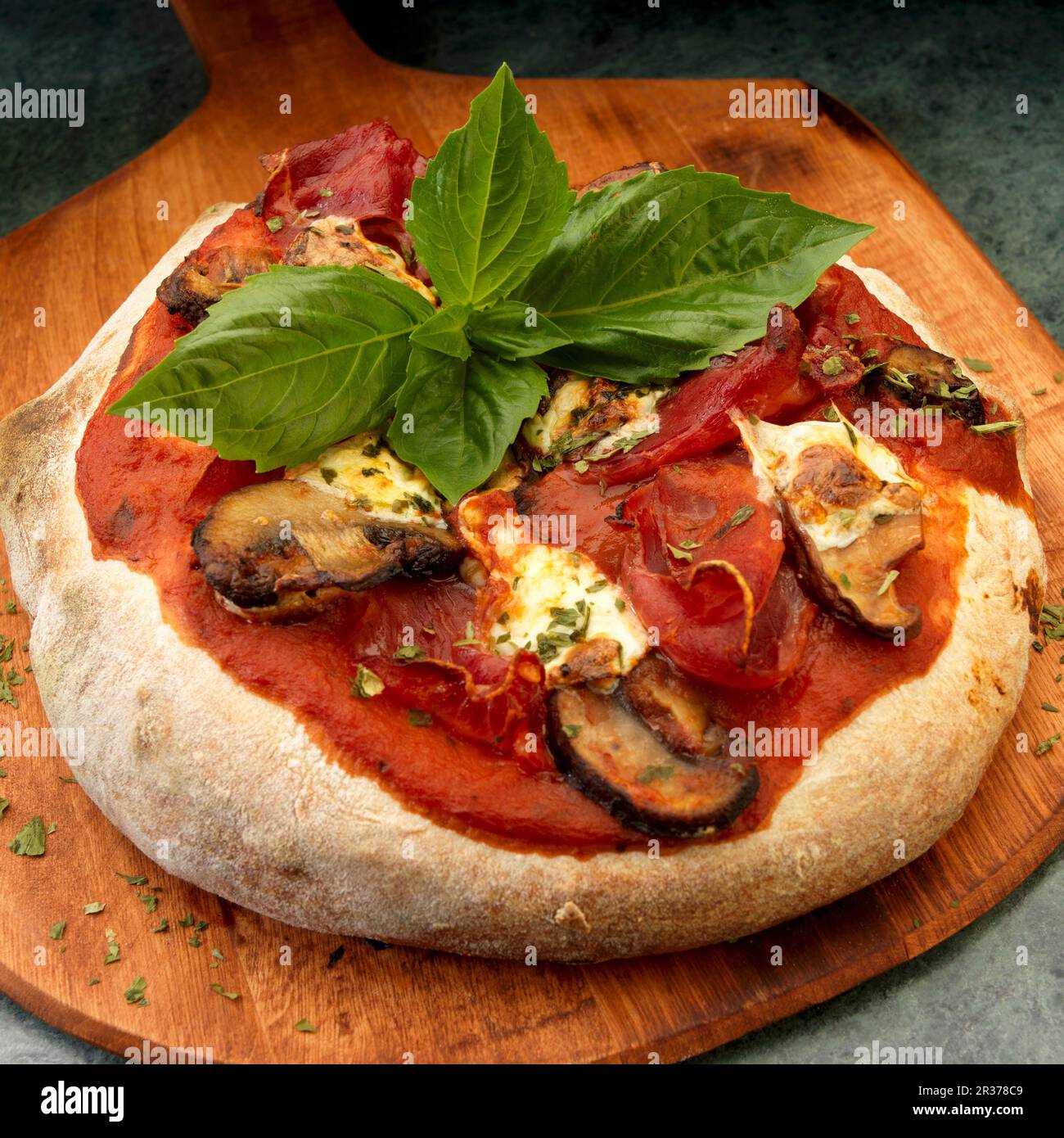 Rustic Pizza with Capicola, Mushrooms and mozzarella and basil Stock ...