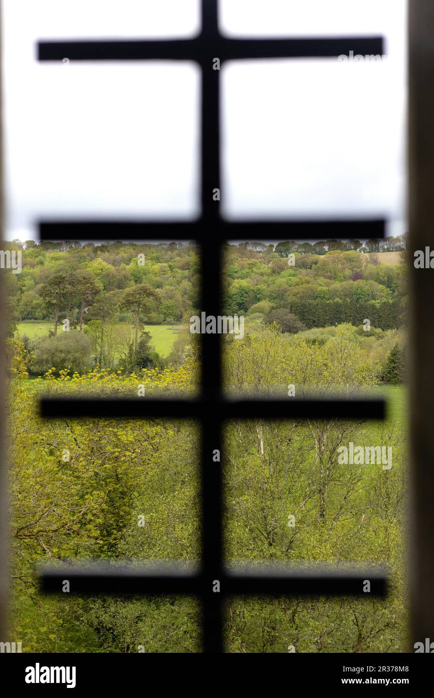 View through window with bars from inside Blarney Castle in Ireland ...