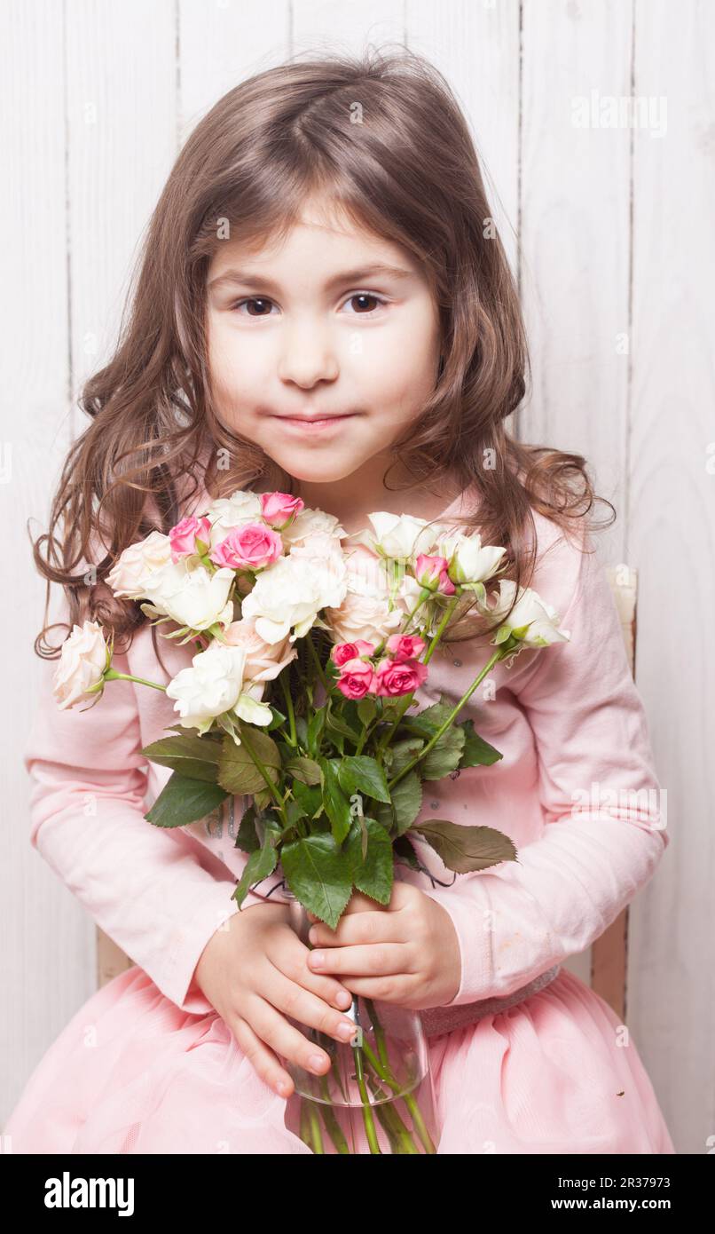 Baby girl giving flower hi-res stock photography and images - Alamy