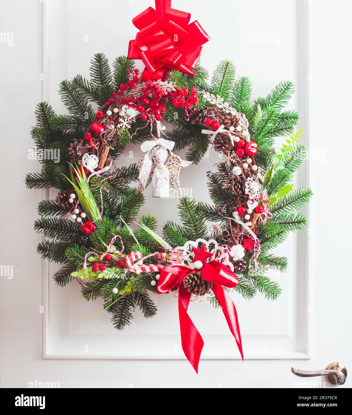 Christmas wreath door red berries hi-res stock photography and images ...