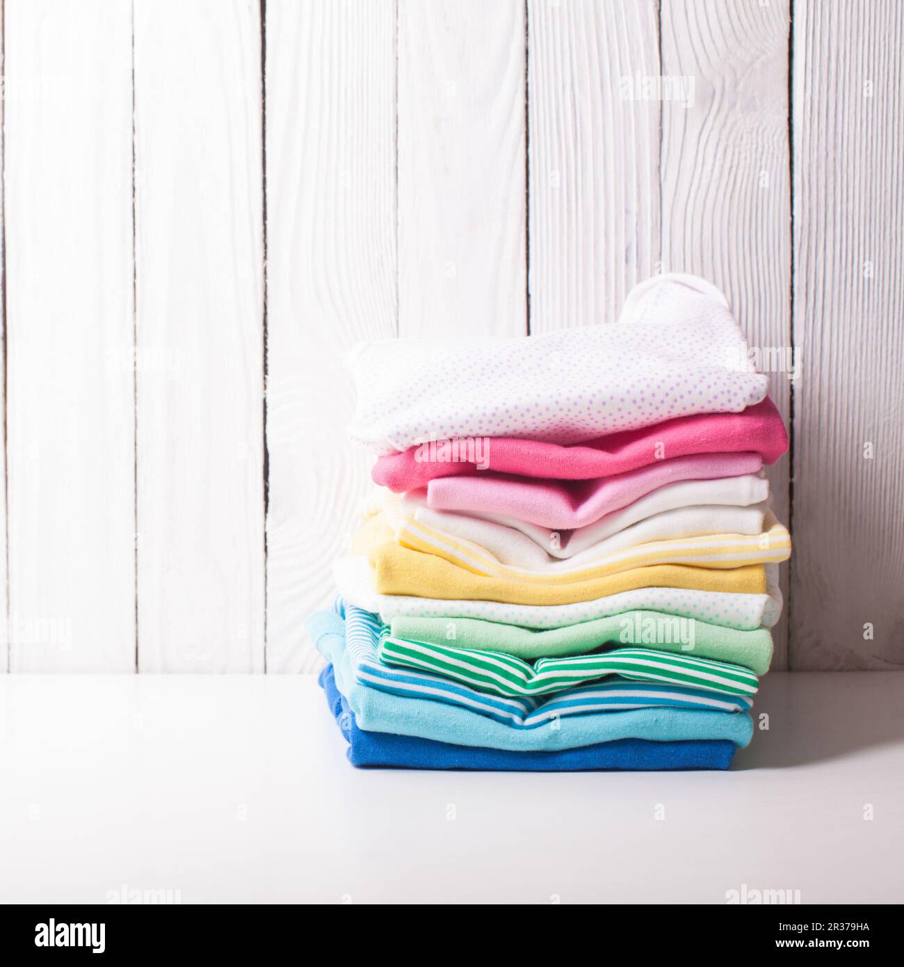 Folded baby clothes Stock Photo - Alamy