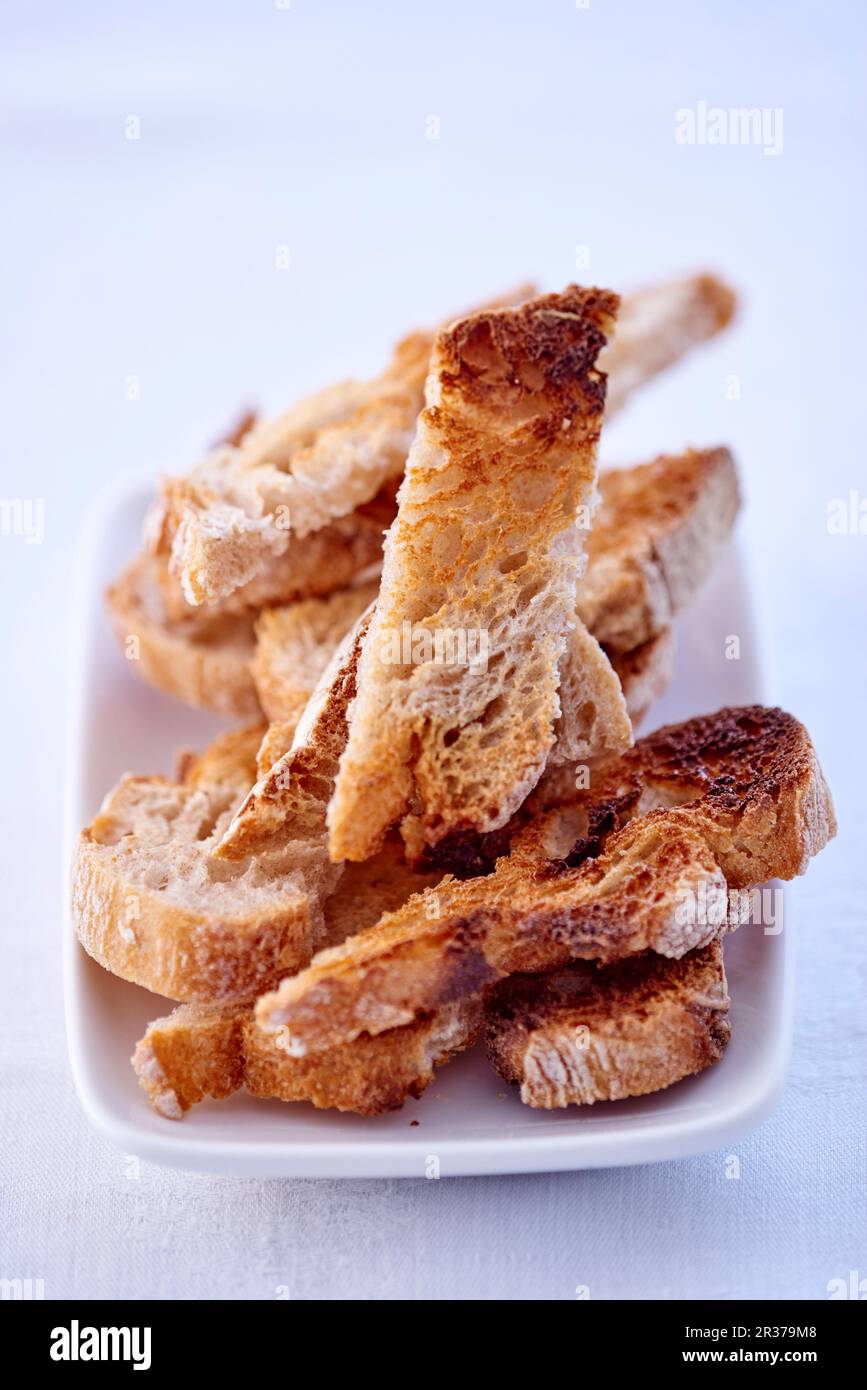 Toasted bread strips on a plate Stock Photo - Alamy