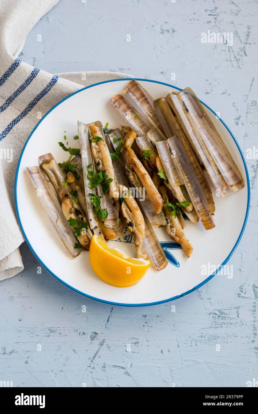 Grilled Grooved Razor Shell Stock Photo - Alamy