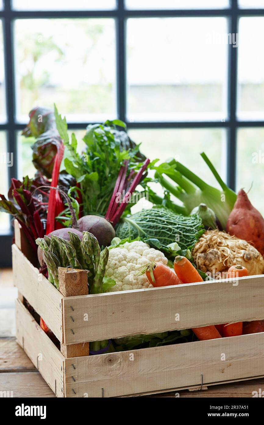 A vegetable crate in front of a window Stock Photo - Alamy