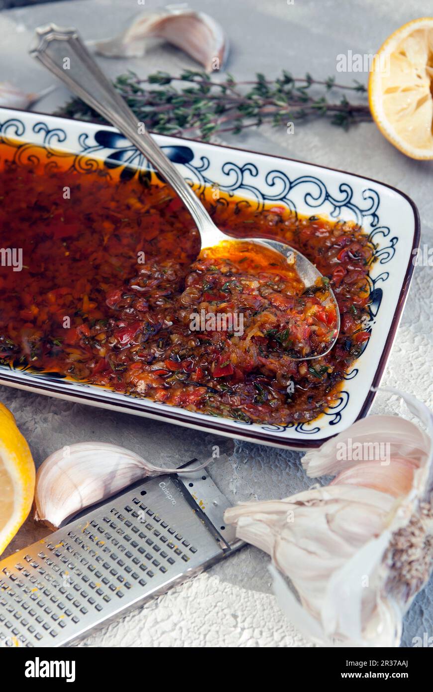 Spicy garlic-infused olive oil Stock Photo - Alamy