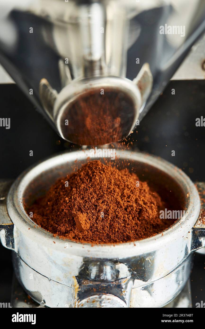 Freshly ground coffee falls hi-res stock photography and images - Alamy
