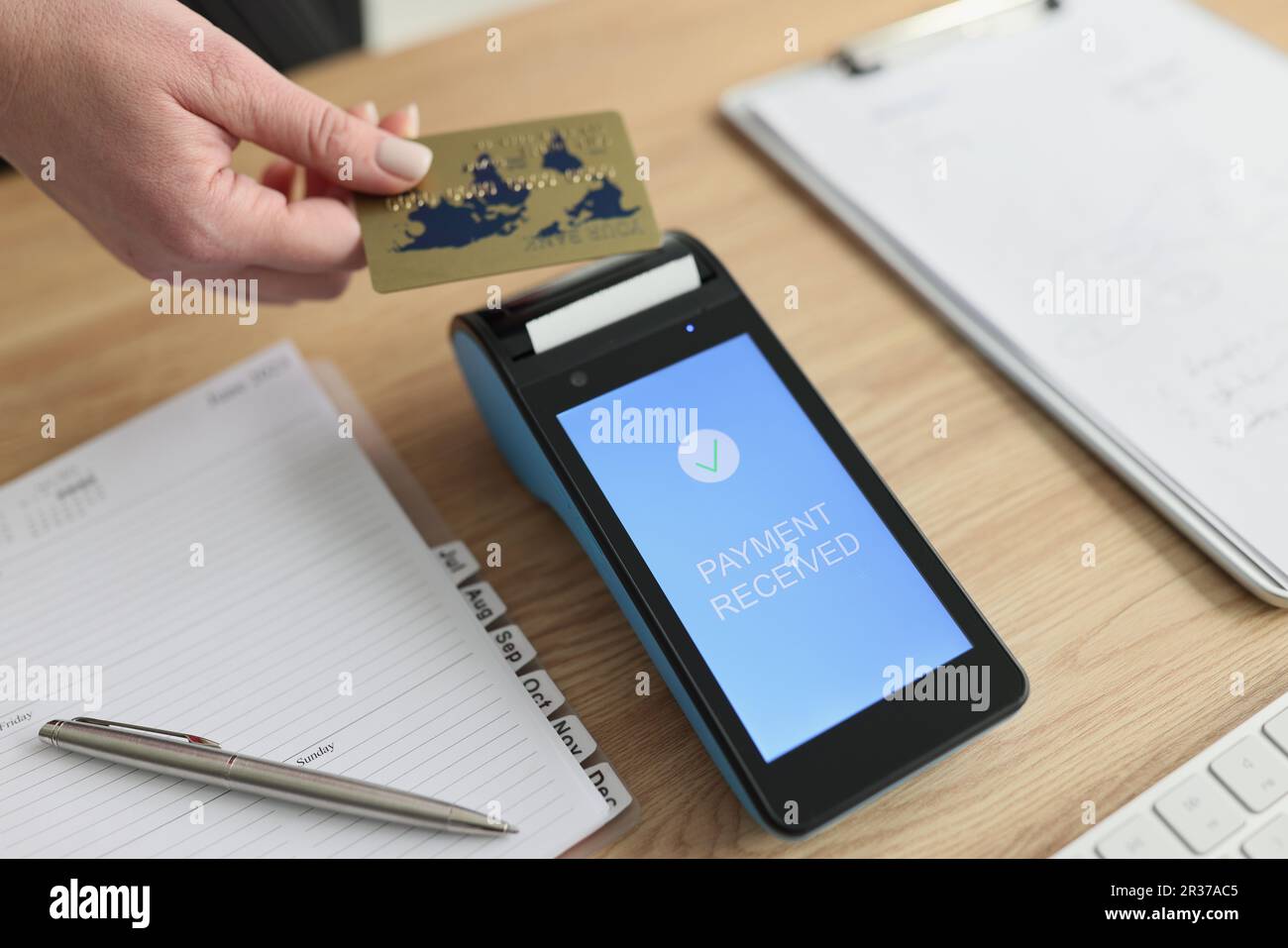 Female person puts card to modern terminal trying to pay Stock Photo ...