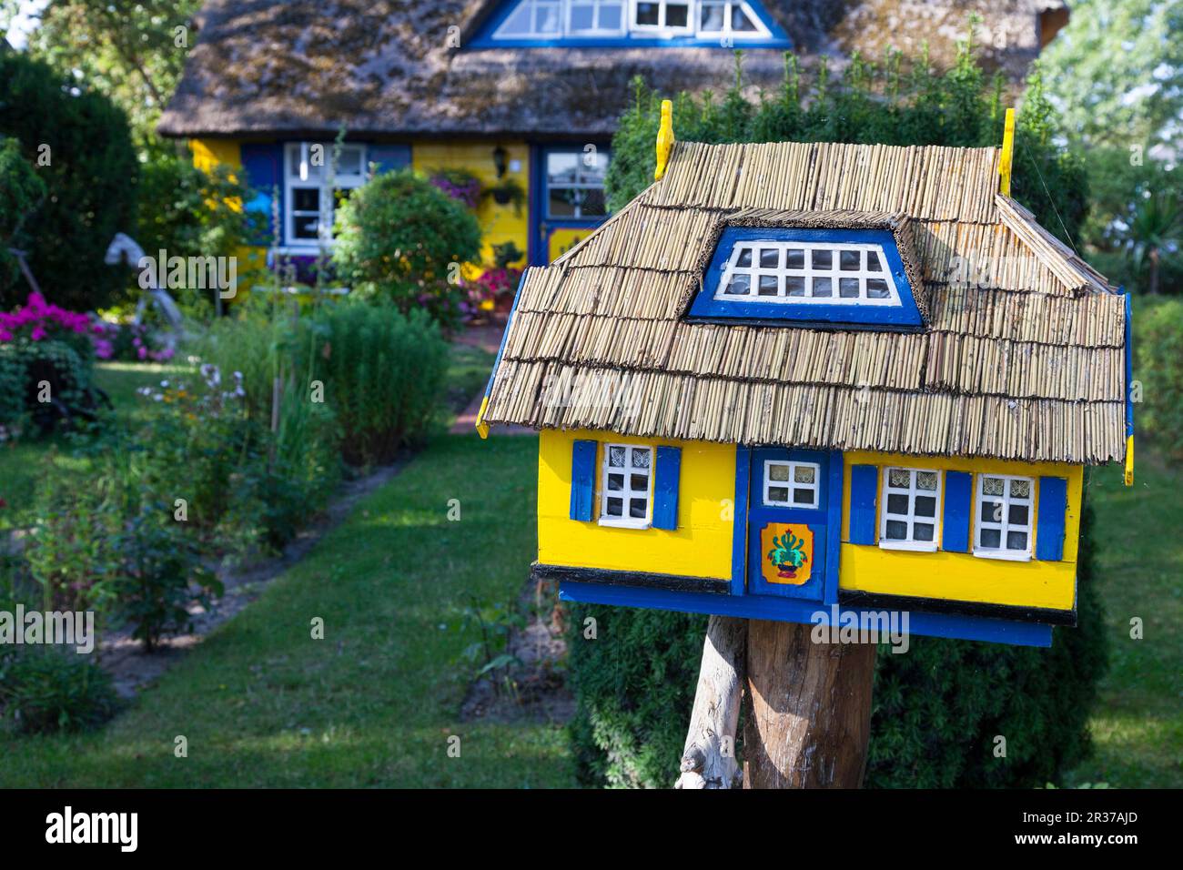 Miniature house as letterbox Stock Photo - Alamy