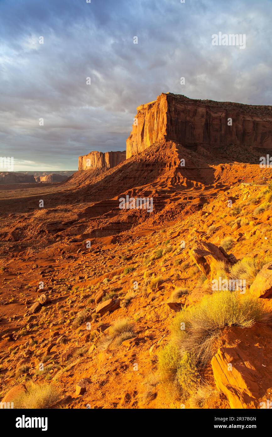 Orange colours during sunrise in this iconic view of Monument Valley ...